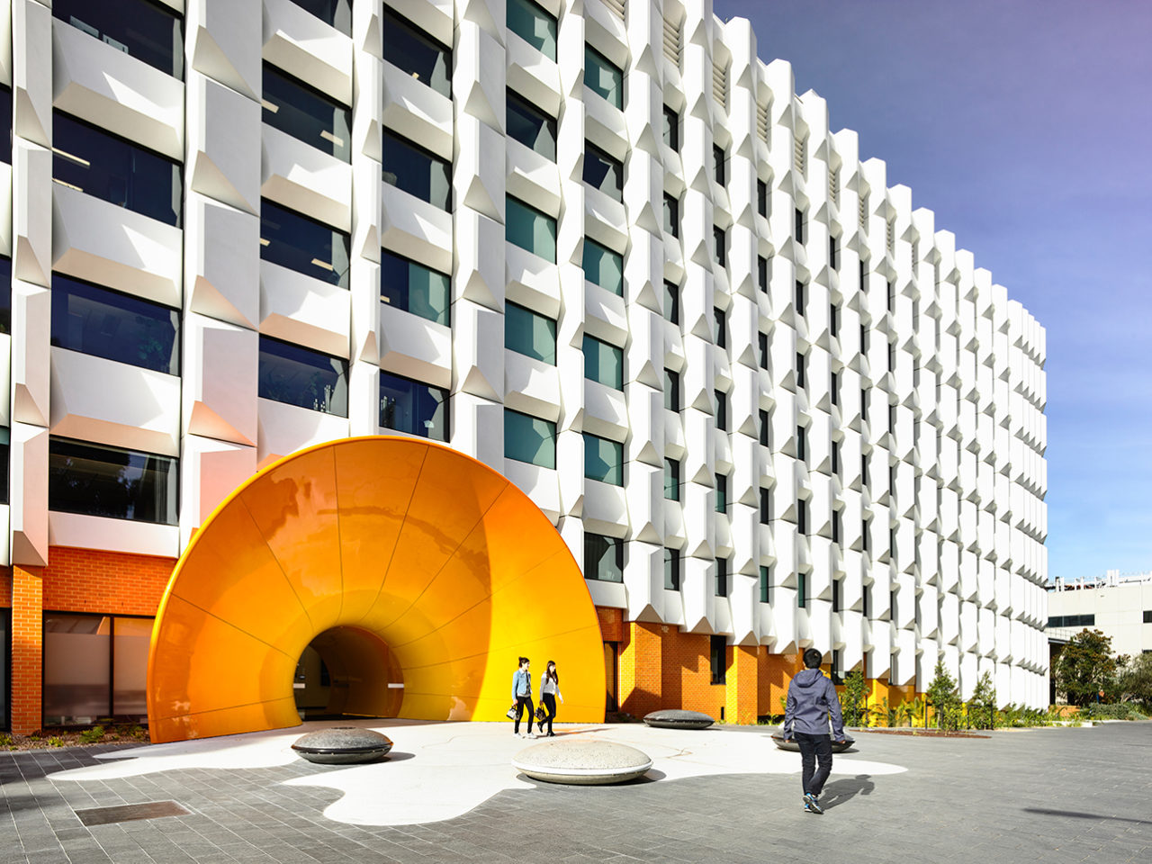 A New, Energy-Efficient Facade—and Dramatic Funnel Entryway—Transformed ...